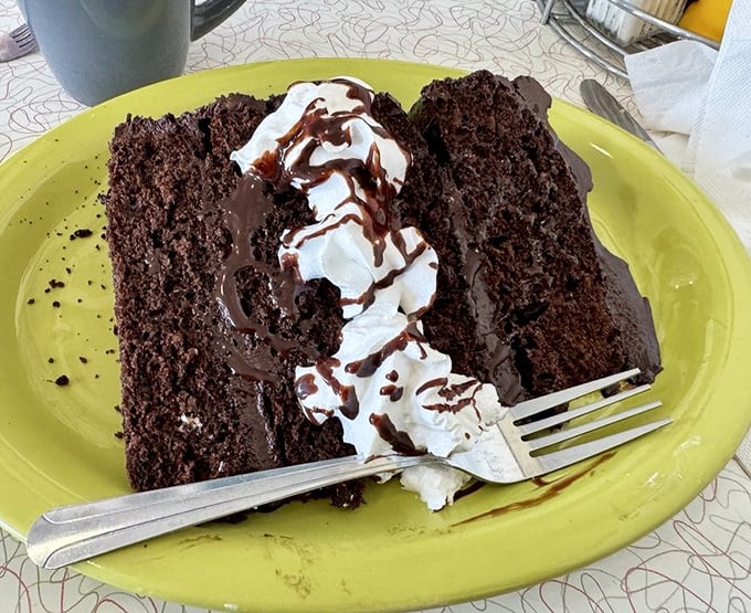 Chocolate cake so rich it should have its own tax bracket &ndash; layers of decadence with whipped cream that melts into chocolatey valleys.