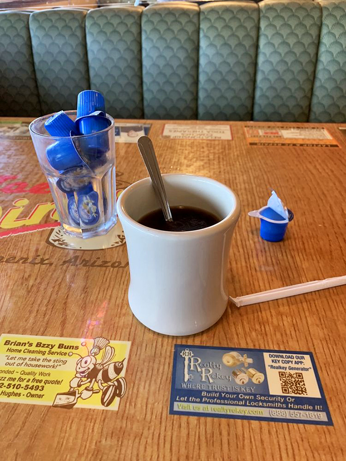 Coffee: The lifeblood of diners everywhere &ndash; served in thick white mugs that somehow make every sip taste like morning optimism.