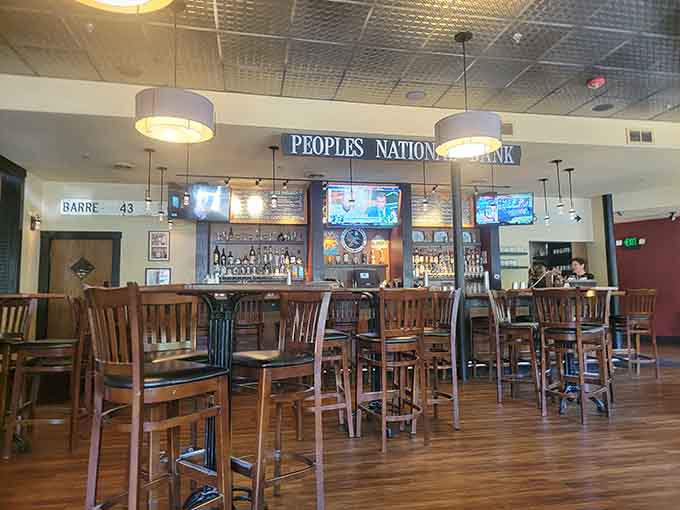 The bar serves as the heart of Cornerstone, where craft beers flow and conversations flourish under soft lighting.