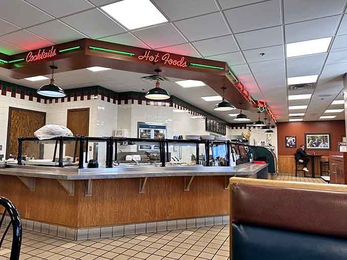 The counter area with its retro charm and neon signs adds character to the dining experience.