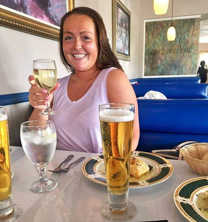 Pure joy captured in a wine glass, because sometimes the best moments are the simplest ones shared over a great meal.