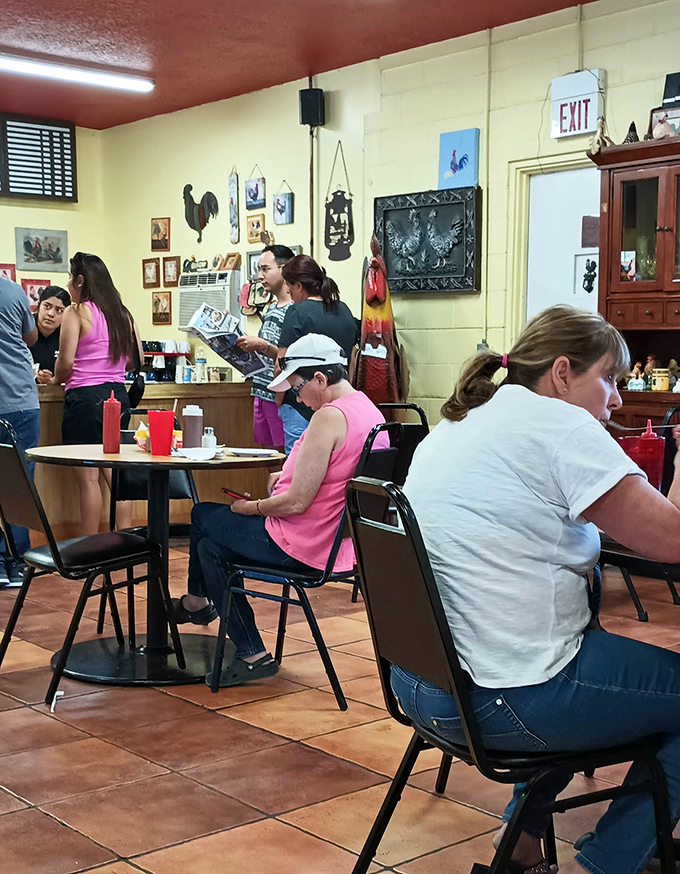 Diners settle in at simple tables, where conversations flow easily between regulars and first-timers in this community gathering spot.