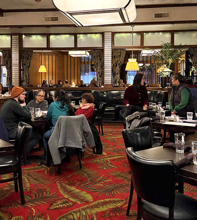 Conversations bloom around these tables like the patterns on the carpet&mdash;proof that good food creates community wherever it's served.