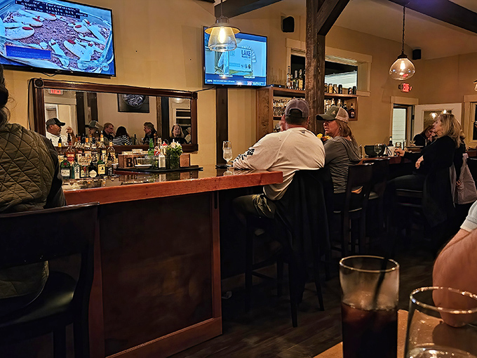The bar buzzes with conversation as patrons gather for pre-dinner drinks or linger over nightcaps.