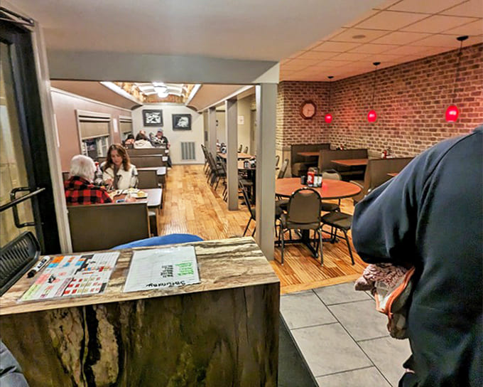 The dining area balances cozy and spacious, with enough privacy for intimate conversations about who gets the last bite.