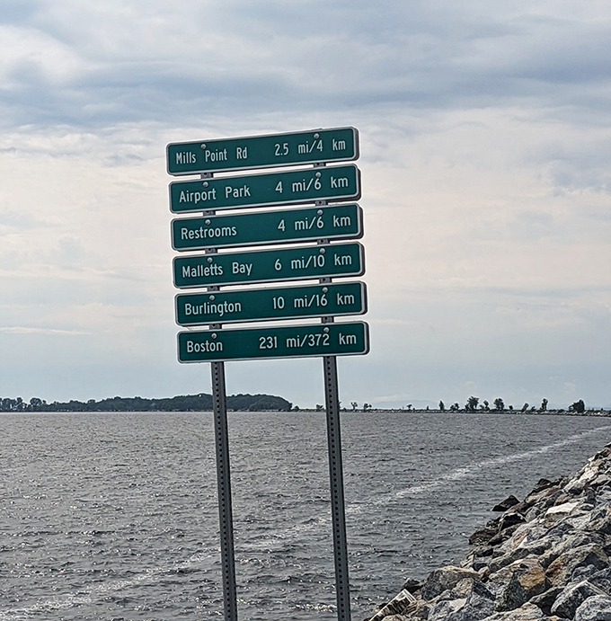 Directional signs keep adventurers on track, pointing the way to island connections and lakeside attractions along the route.