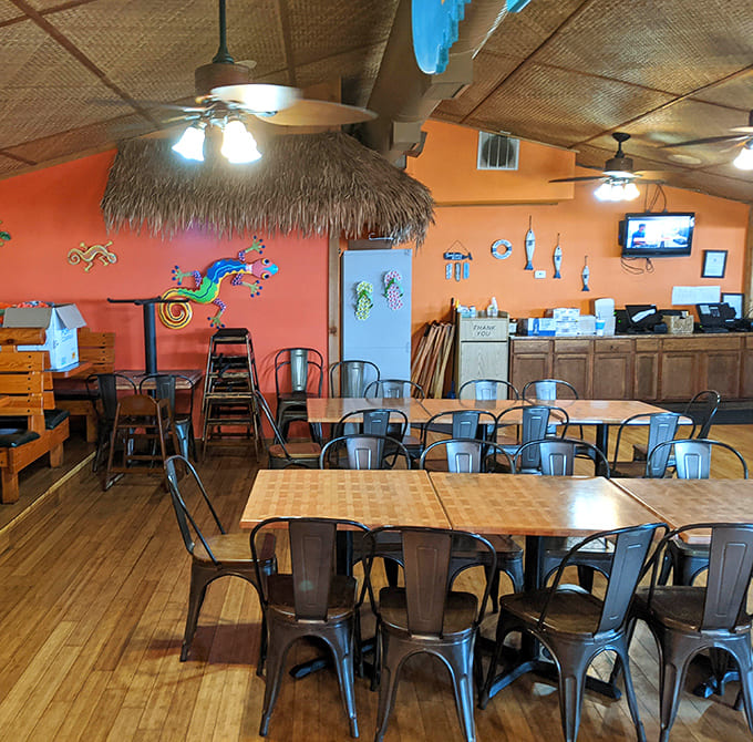 The rustic interior with exposed beams creates a cozy lodge atmosphere that somehow still feels breezy and beachy.