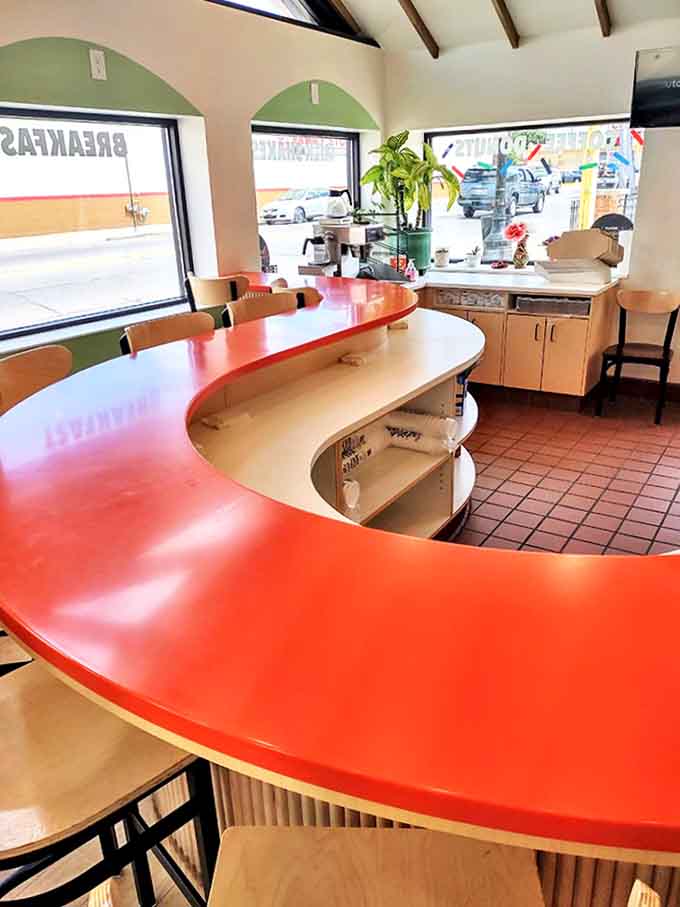 The bar seating area offers front-row seats to the donut action, perfect for those who like their breakfast with a side of people-watching.