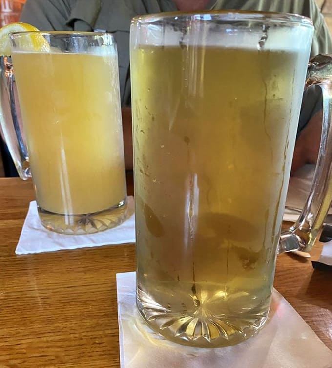 Cold beer in generous glasses, the perfect companion for smoky ribs and good conversation with fellow diners.