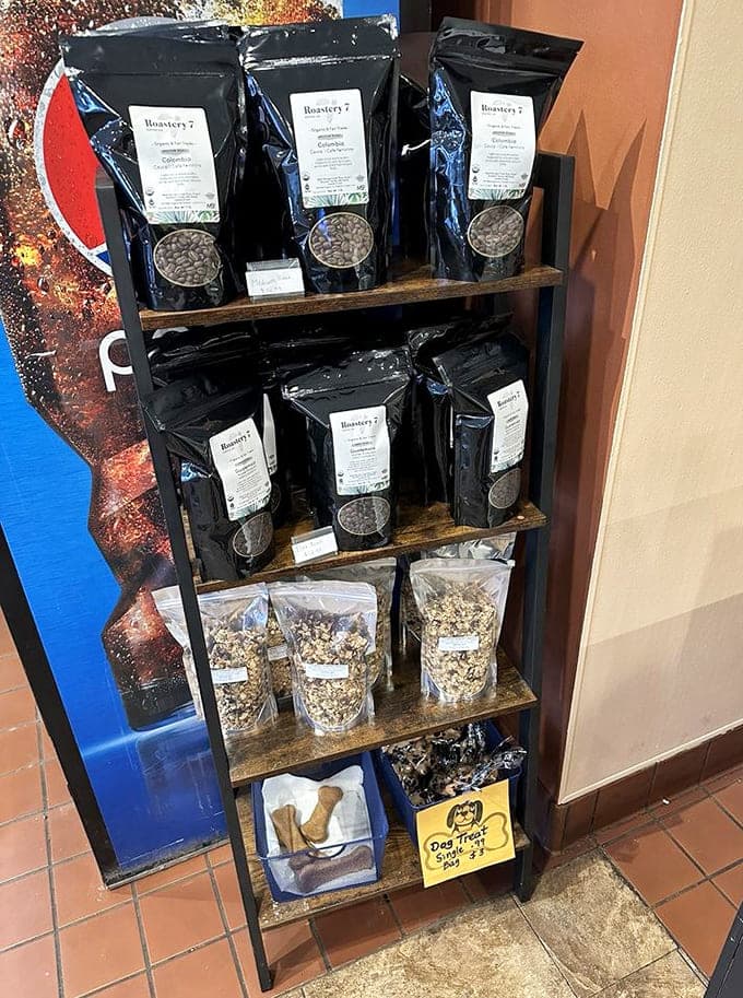 Local coffee beans and specialty items line the shelves, supporting other small businesses while giving customers tasty souvenirs.