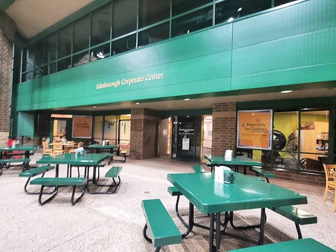 Seating areas with those distinctive green tables provide rest stops for parents who've earned a break from supervising the chaos.