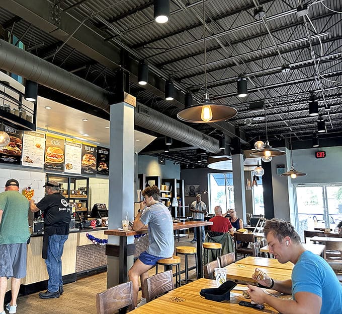 Morning rituals unfold as customers enjoy their bagel creations &ndash; some deep in conversation, others savoring every bite in contemplative silence.