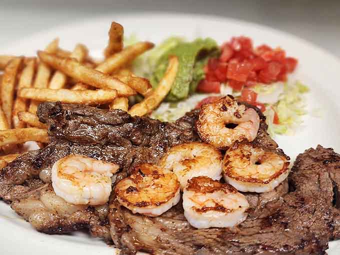 When surf meets turf on a sizzling platter with shrimp and steak, accompanied by fries, everyone at nearby tables reconsiders their order.