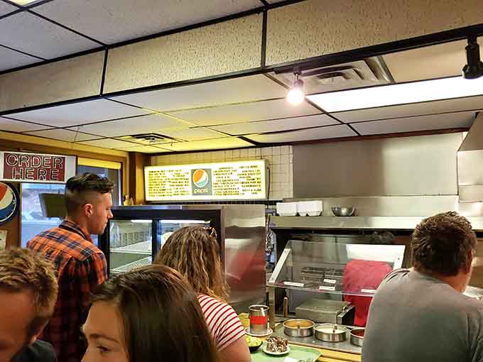 The order counter buzzes with activity as hungry customers line up for their fix of Minnesota's finest gyros.