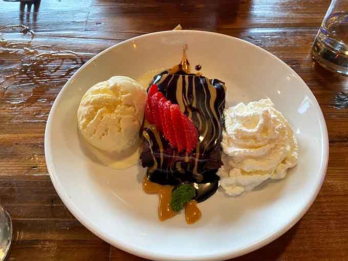 The brownie sundae arrives like a chocolate lover's fever dream, complete with ice cream, whipped cream, and zero regrets about ordering dessert.