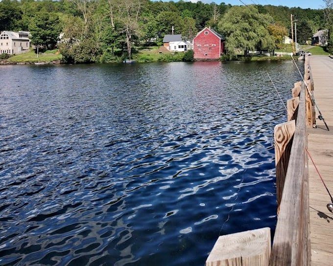 Autumn's golden light bathes the weathered planks, transforming an ordinary crossing into a magical journey across Sunset Lake.