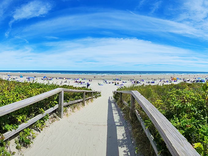 Beach access never looked so inviting! This sandy pathway practically whispers "follow me to paradise."
