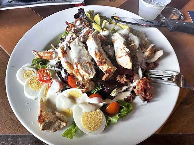 This Cobb salad tells a story of abundance &ndash; grilled chicken, bacon, and eggs arranged like neighborhoods on a delicious map.