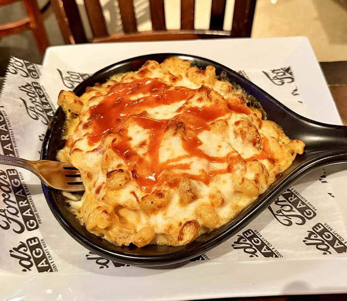 Creamy, indulgent mac and cheese with a drizzle of sauce on top represents comfort food at its finest, the kind that makes you forget about whatever diet started Monday.