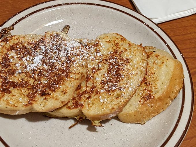 French toast that achieves the golden ratio &ndash; crisp exterior, custardy interior, and just the right dusting of cinnamon and powdered sugar.