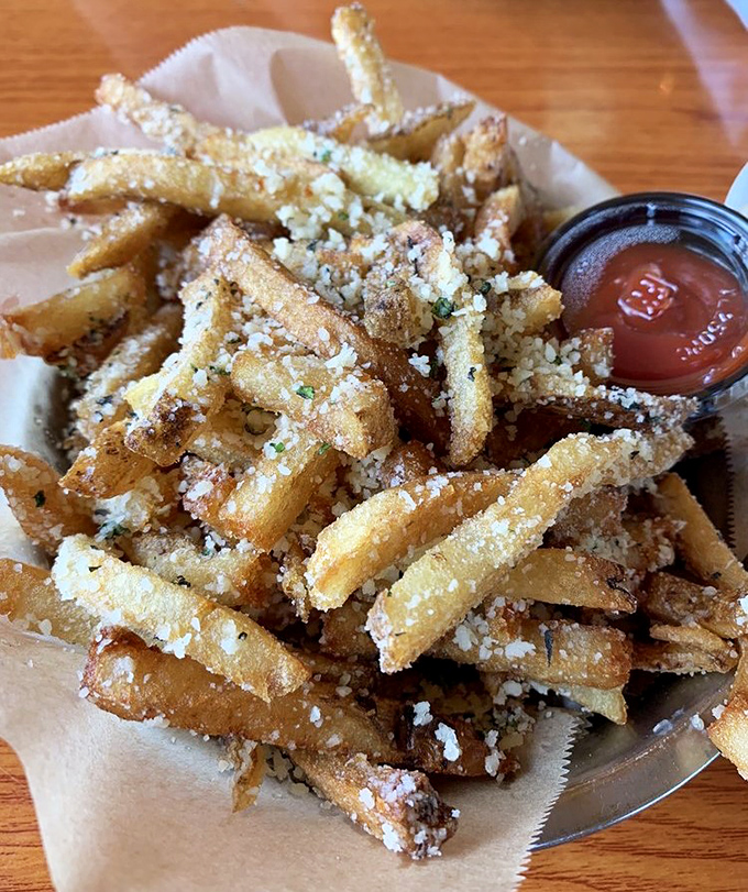 These aren't just fries &ndash; they're potato royalty, dusted with parmesan and herbs that elevate them from side dish to main attraction.