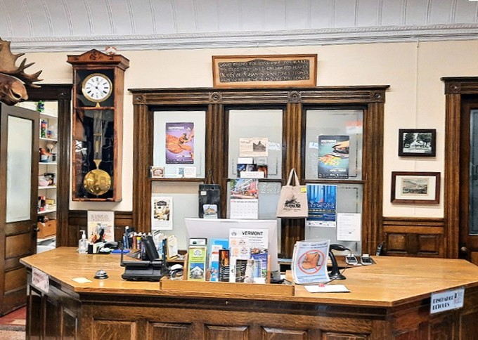 Front Desk: Command central of this literary border crossing, where librarians stamp books that travel between nations without ever leaving the building.