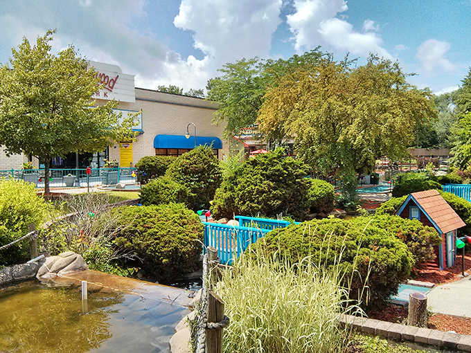 Lush greenery provides a peaceful counterpoint to the excitement inside, with carefully maintained paths winding through the outdoor space.