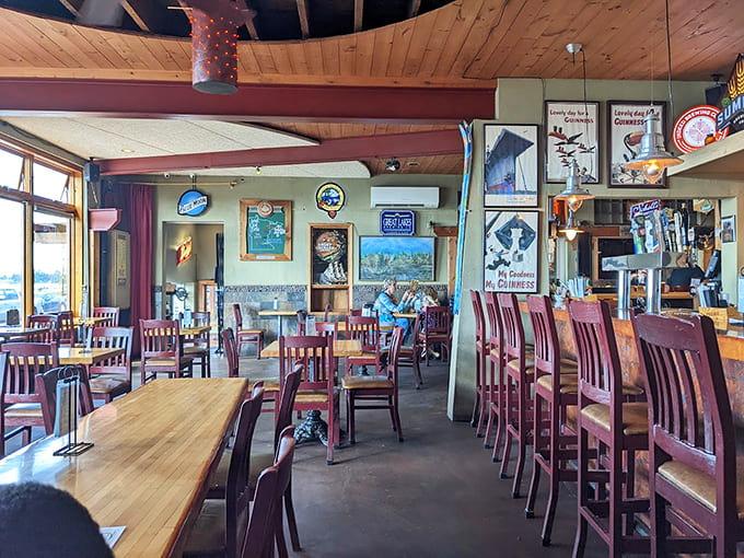 The interior's eclectic decor and vintage signs create an atmosphere that's part northwoods cabin, part neighborhood hangout, all welcoming.