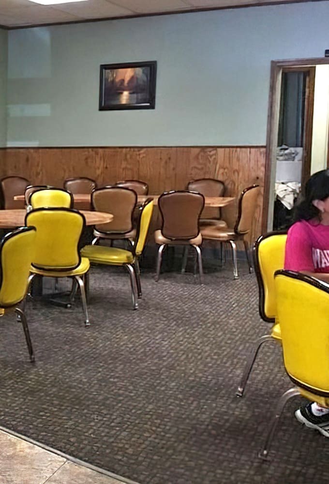 More yellow chairs and wood paneling create a no-frills atmosphere where the food does all the talking, and it's very chatty.