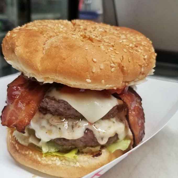 This double bacon cheeseburger looks like it's about to start its own fan club, and honestly, who could blame it?