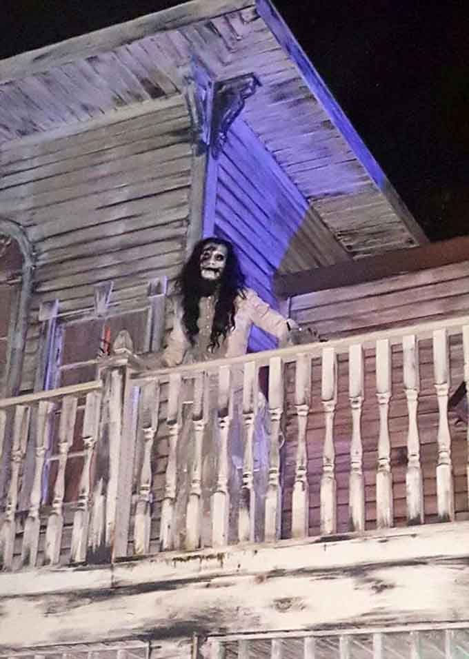 That ghost on the balcony is either an incredibly dedicated actor or the real deal, and honestly, either option is equally unsettling at this point.