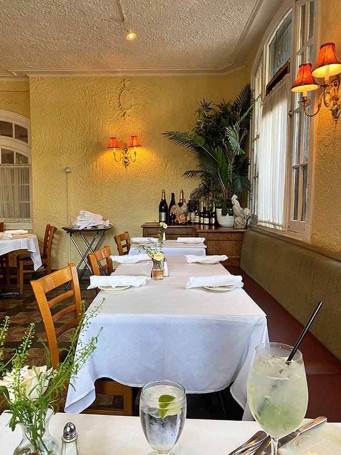 Another angle reveals the thoughtful layout that makes every table feel intimate, with fresh flowers and careful lighting setting the mood for romance or celebration.