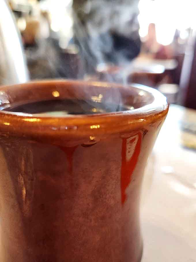Hot coffee in a proper ceramic mug, steaming and ready for endless refills, because some traditions are worth keeping forever.