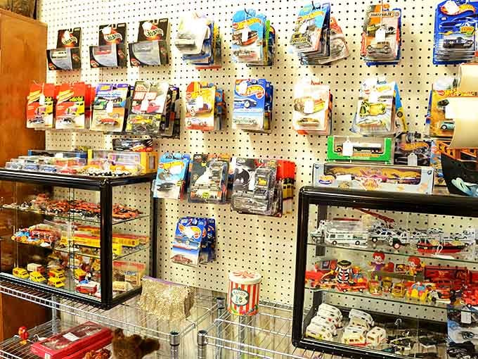Hot Wheels and die-cast treasures lined up like a miniature automotive museum, their tiny paint jobs still gleaming after all these years.