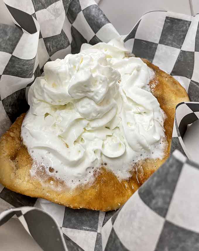 The dessert arrives with enough whipped cream to make you wonder if they're compensating for something, then you taste it and understand completely.