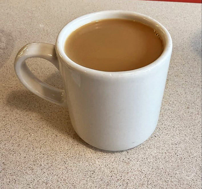 Coffee in a classic diner mug, ready for multiple refills while you solve the world's problems one sip at a time.