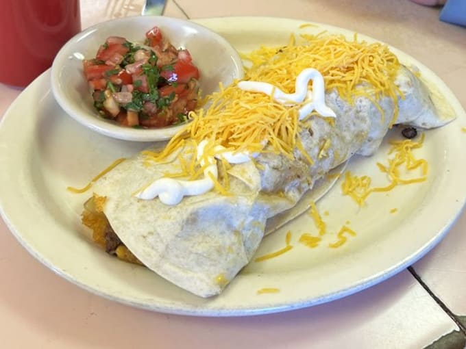 A breakfast burrito this loaded requires an engineering degree to eat properly, but the delicious struggle is absolutely worth it.