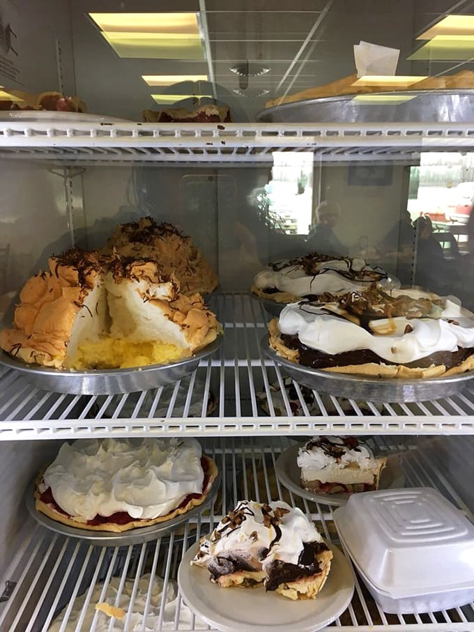 The pie case displays homemade treasures with towering meringue peaks that could make a grown person weep with anticipation.