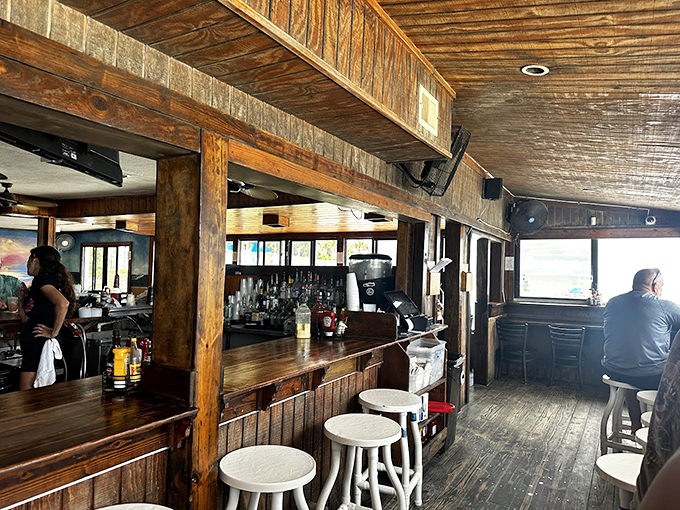 Rustic beams and weathered wood create the perfect casual-cool vibe, like a beach house living room where everyone's welcome.