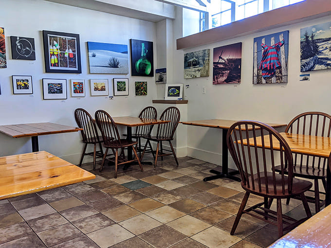 More wooden tables and local photography create an atmosphere that says "stay awhile" louder than any welcome sign could.