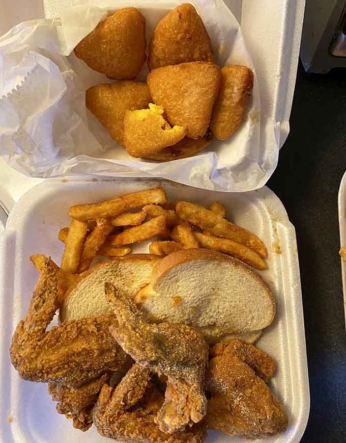 Four wings, fries, and bread make a complete meal that proves sometimes the classics become classics for very good reasons indeed.