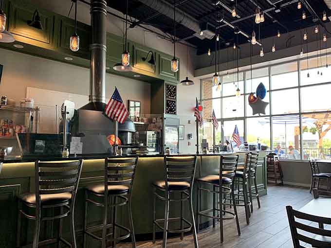 The bar area invites you to settle in with a craft beer and watch the pizza magic happen in real time.