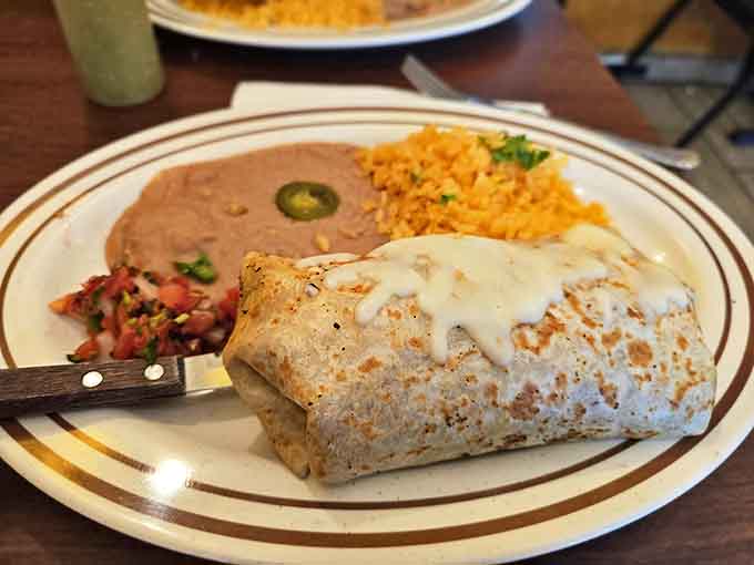 This burrito arrives wrapped tight and stuffed full, maintaining structural integrity while delivering balanced flavors in every single bite.