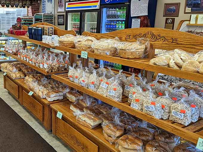 Wooden display racks showcase Kennedy's commitment to presentation, making even the packaged treats look like they're worth the trip to Cambridge all by themselves.