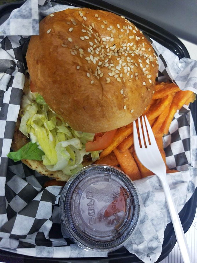 A towering achievement of culinary engineering &ndash; juicy lamb patty, fresh toppings, and sauce that will inevitably drip down your arm. Worth every napkin.