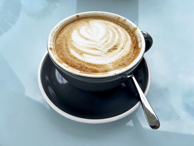 Art in a cup: delicate foam designs float atop locally roasted espresso, proving coffee can be both beautiful and delicious.
