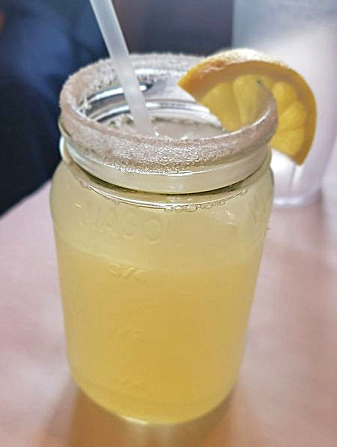 This isn't just lemonade—it's summer in a mason jar, complete with a sugared rim that makes every sip a perfect sweet-tart balance.
