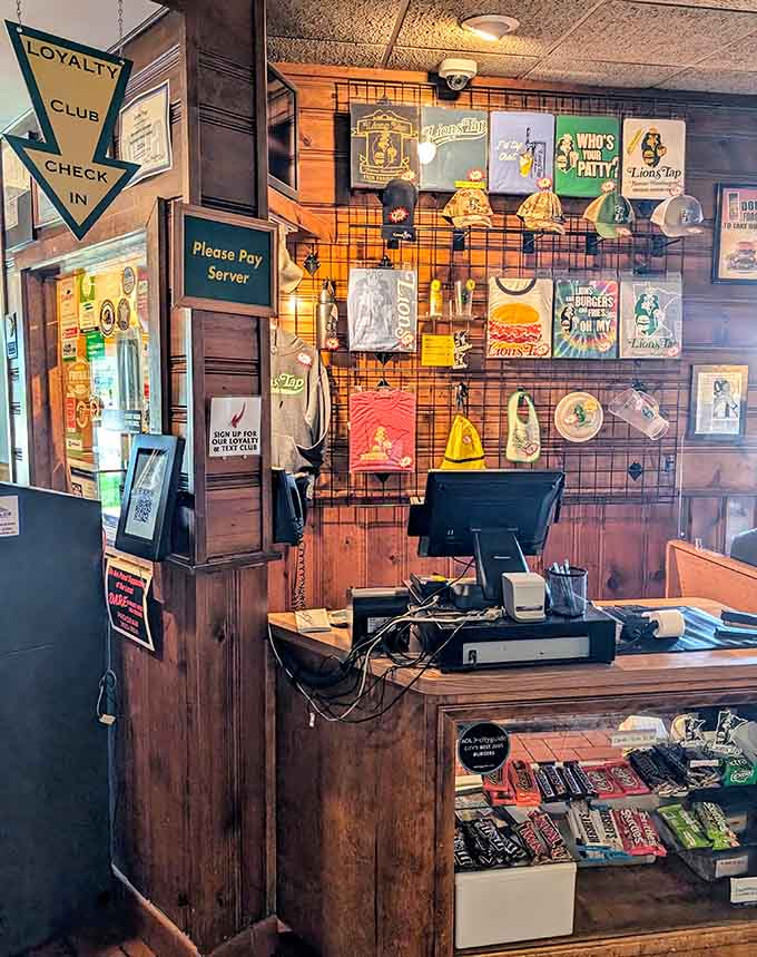 The counter area where orders are placed and dreams of burger perfection begin, decorated with the kind of memorabilia that tells decades of delicious stories.