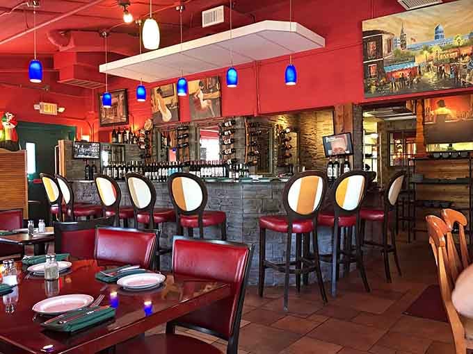 The bar area features stone facades and mood lighting, offering liquid courage and wine selections that won't require a second mortgage to enjoy properly.