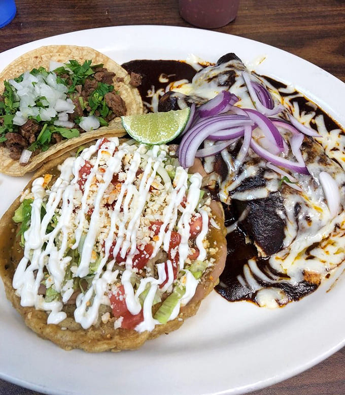 Three distinct tacos showcase the kitchen's range, each one a perfectly composed bite of Mexican tradition done right every single time.